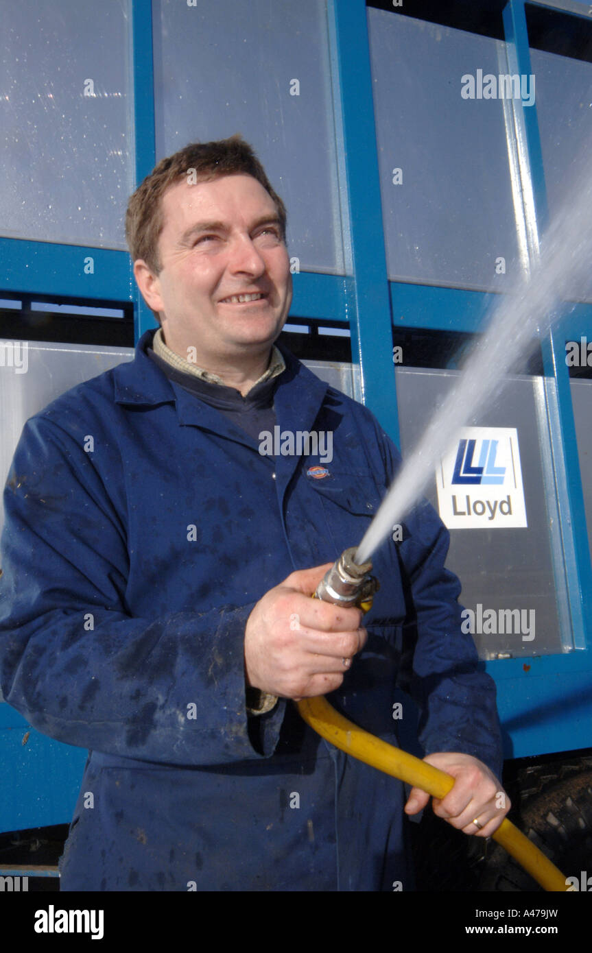 farmer washing off livestock wagon Stock Photo - Alamy