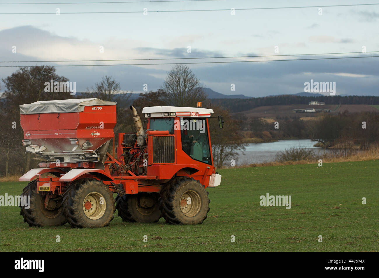 Self propelled fertiliser spreader applying Potash to reseeded meadow ...