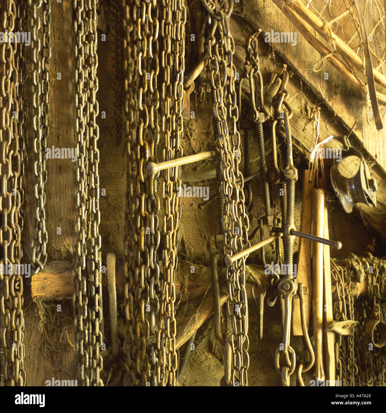 Chains and pullies hanging on the wall of a barn in the Black Forest ...