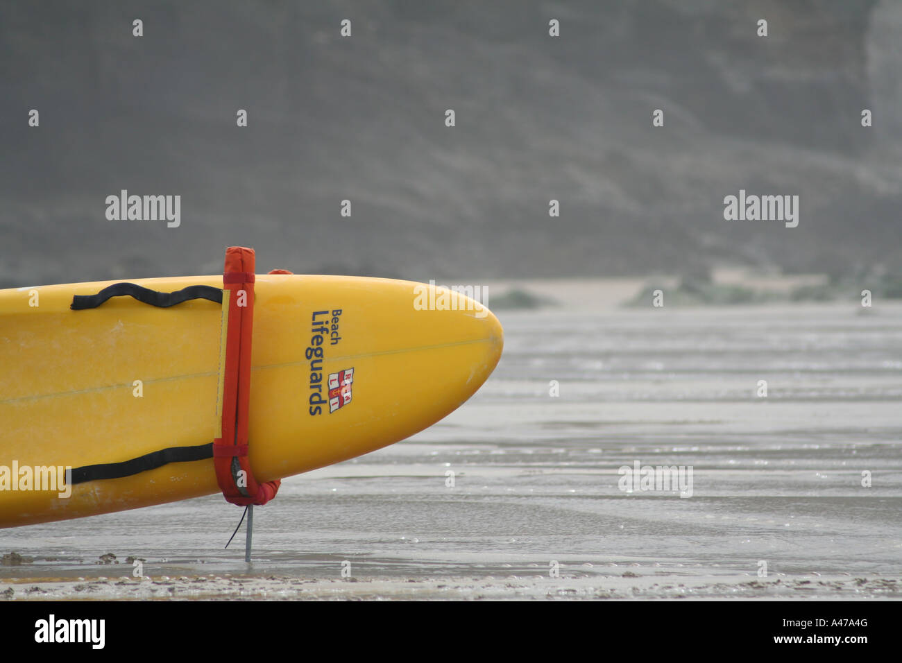 RNLI lifeguard surfboard on beach Stock Photo - Alamy