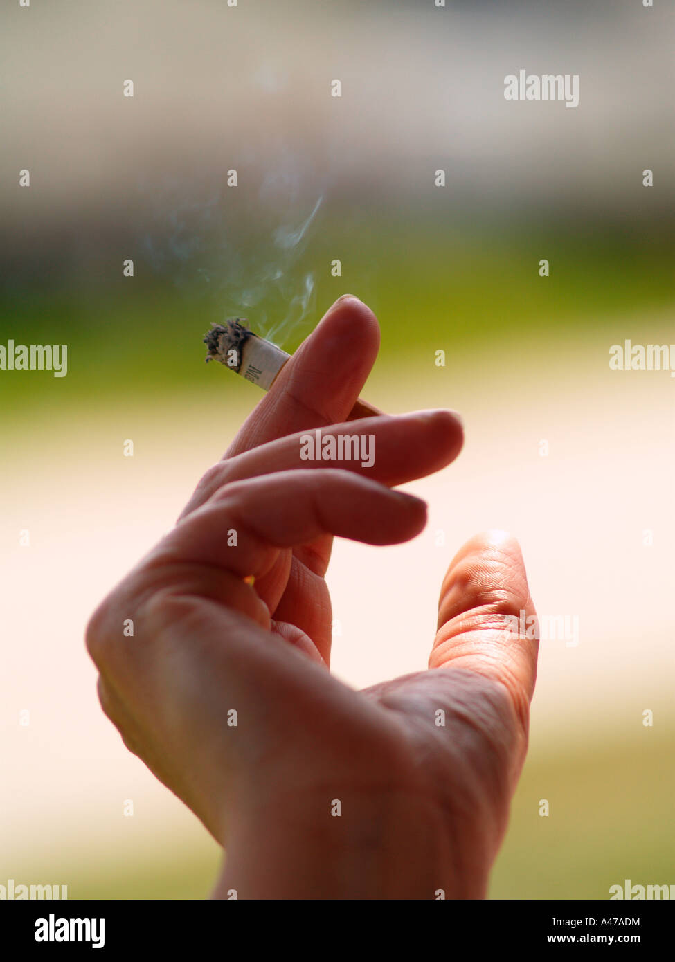 hand in motion with cigarette Stock Photo - Alamy