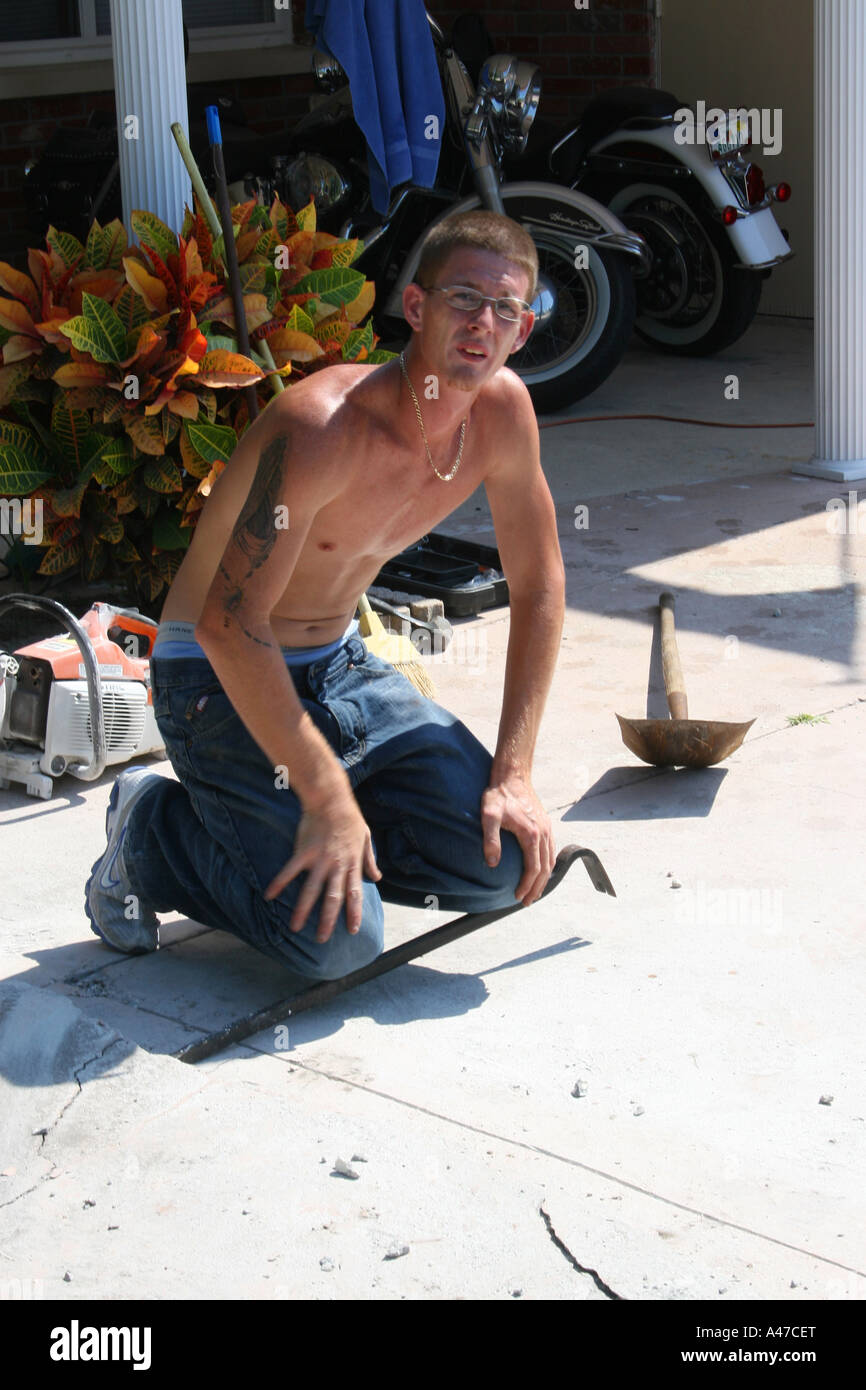 Young Man Breaking a Concrete Slab Stock Photo - Alamy