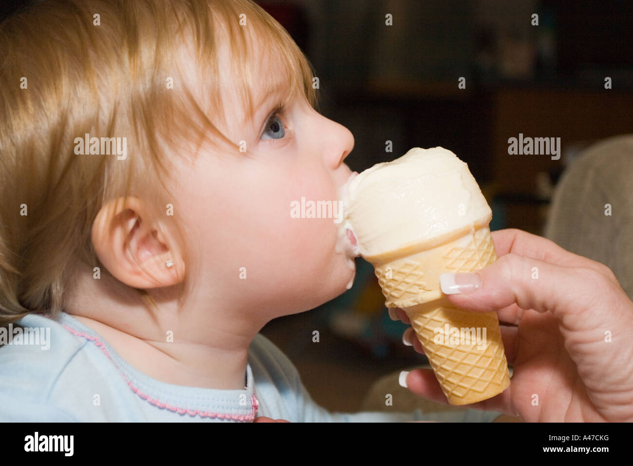 Young Female Child being Served an Ice Cream Cone Stock Photo - Alamy