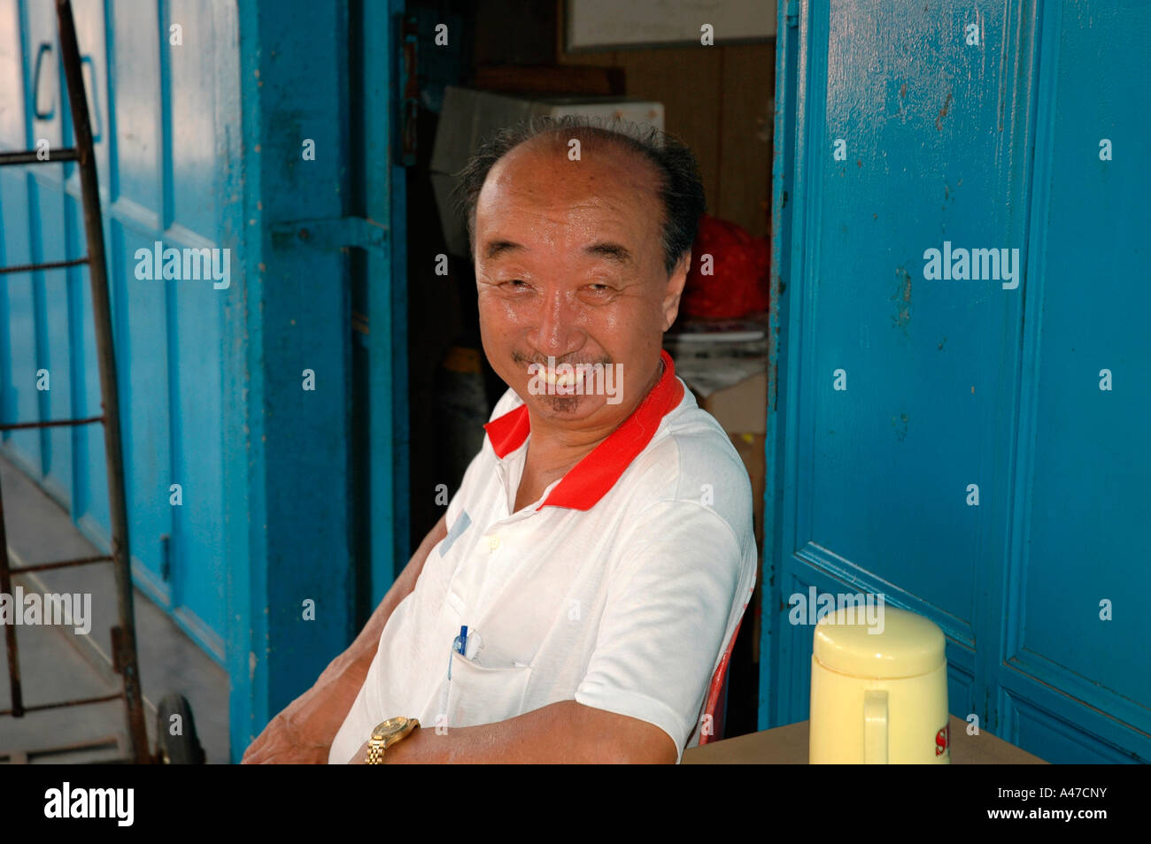 Chinese store owner, Malaysia Stock Photo - Alamy
