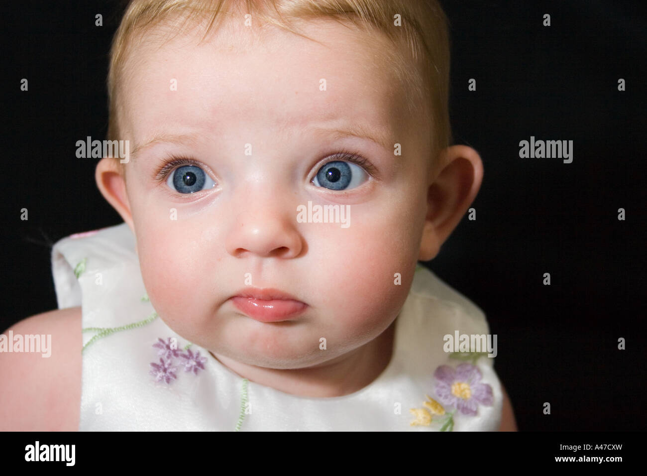 Head and Shoulders of Serious Little Girl with Pursed Lips Stock Photo ...