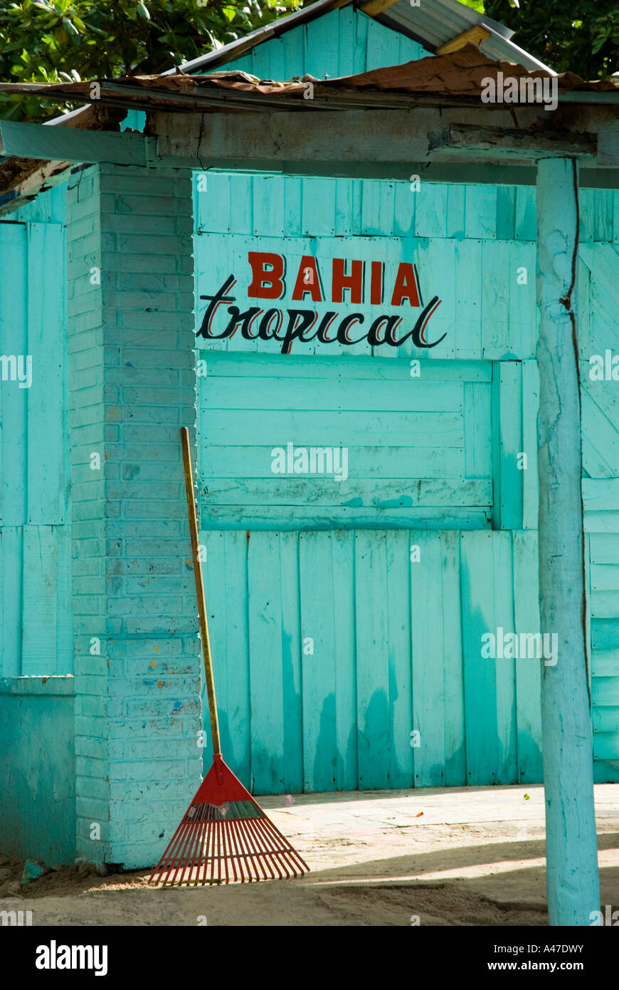Broom for sweeping beach rests in front of changing room, Boca Chica ...