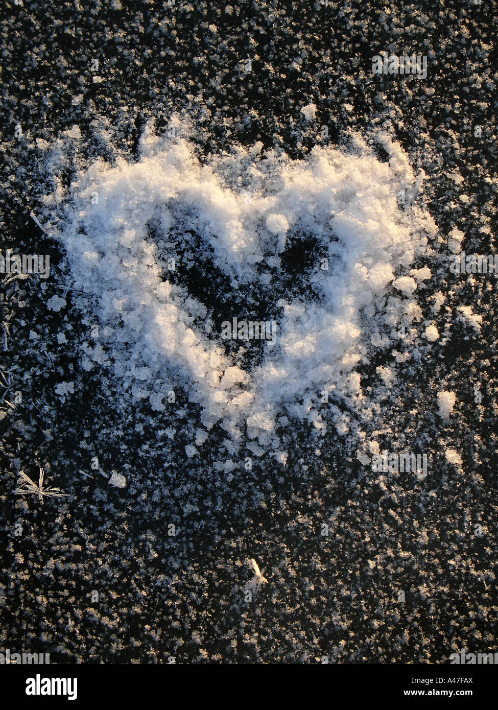 heart made of snow Stock Photo - Alamy