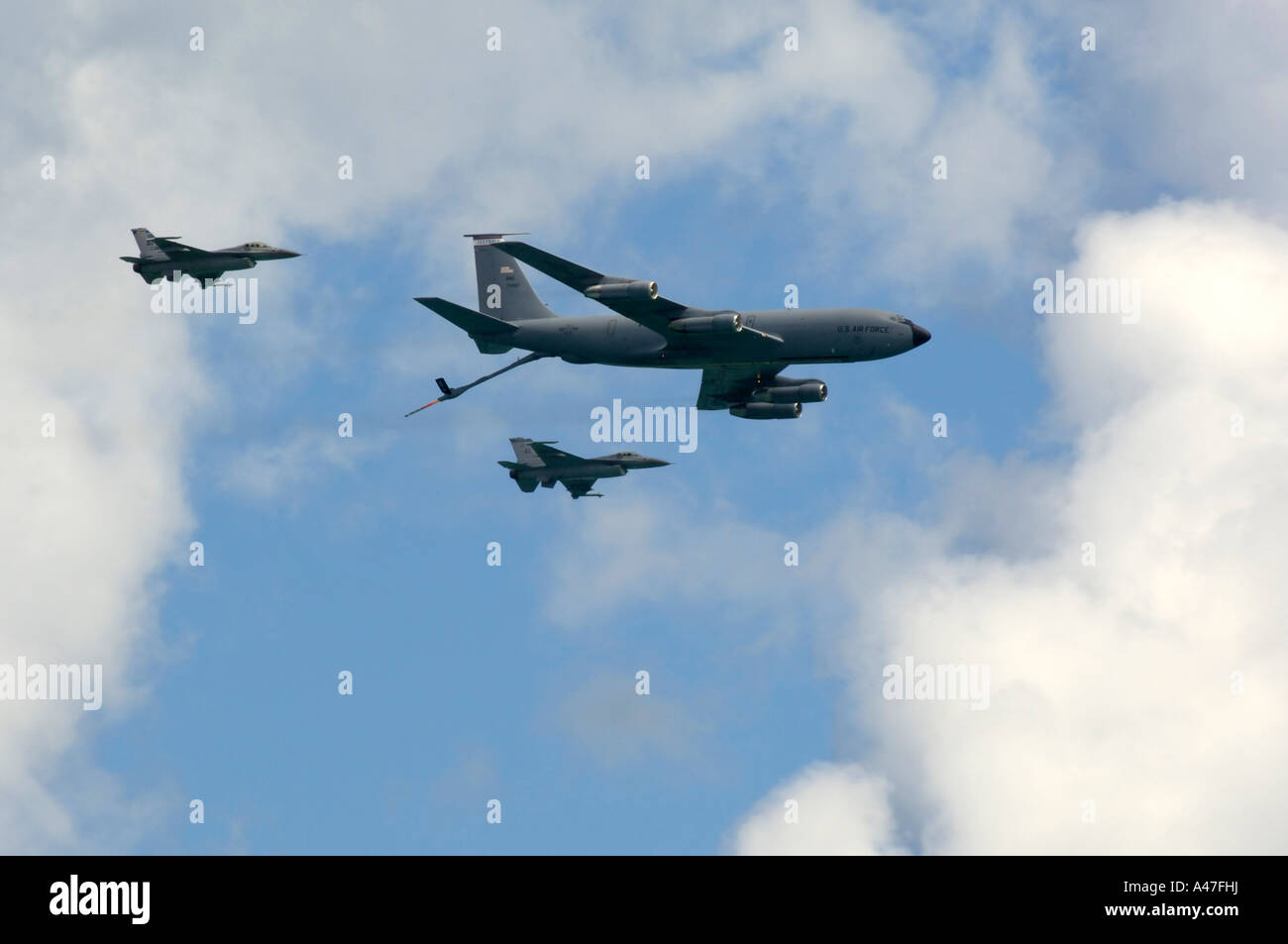 Two escort fighters accompany a refueling jet at the Chicago Illinois ...