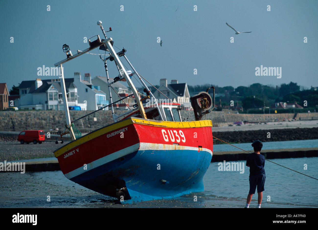 Boat at low tide Vazon Bay Stock Photo - Alamy
