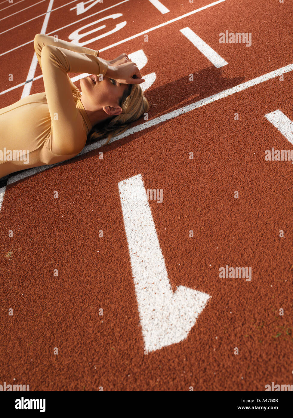 Female sprinter on finish line Stock Photo - Alamy
