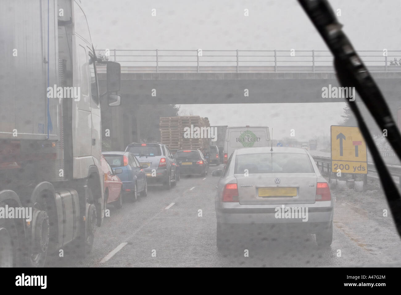 Bad driving conditions in snow and wet weather seen through car ...
