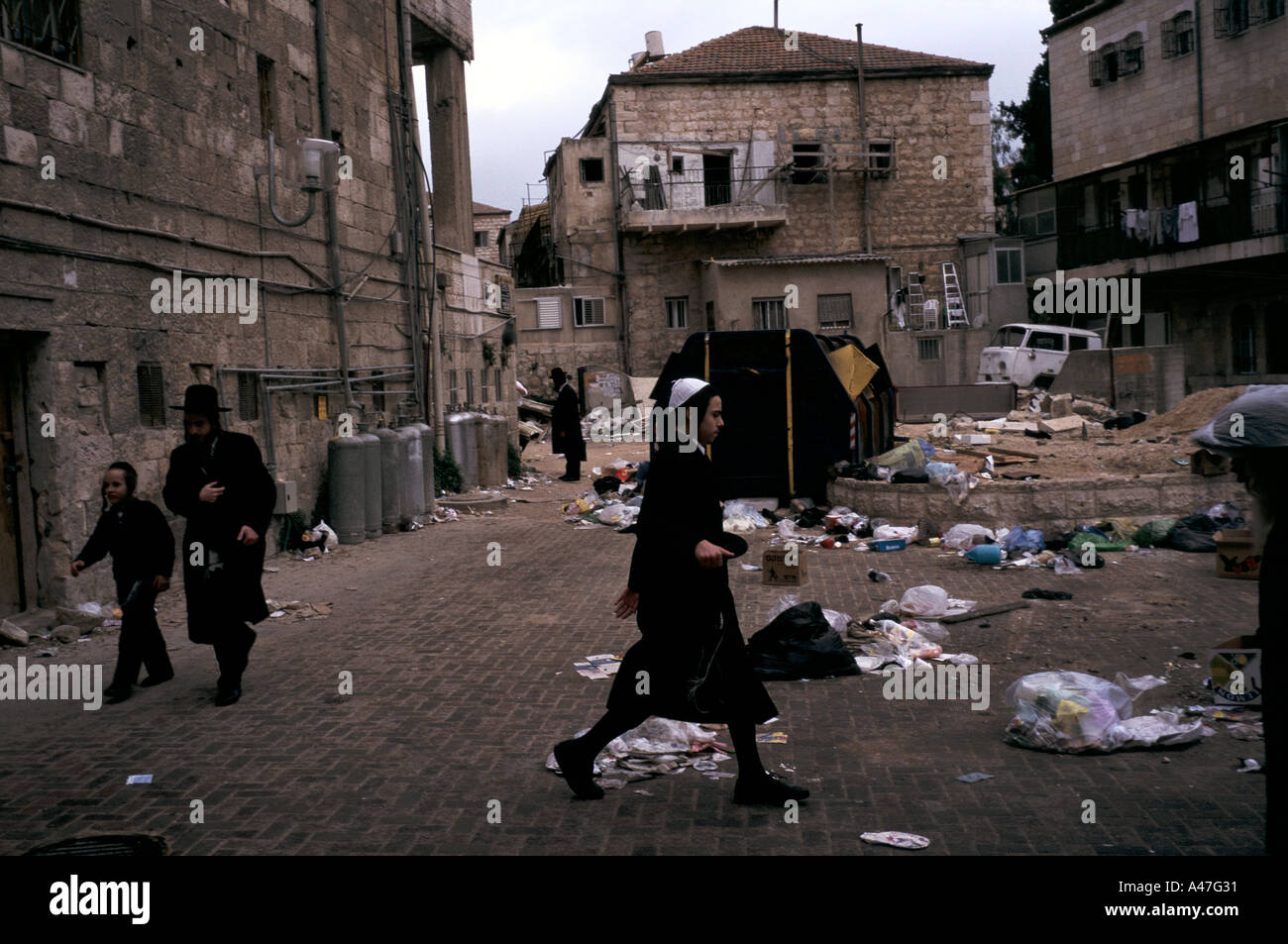 An Orthodox Jewish man and boys in the ultra orthodox ghetto of Meir ...