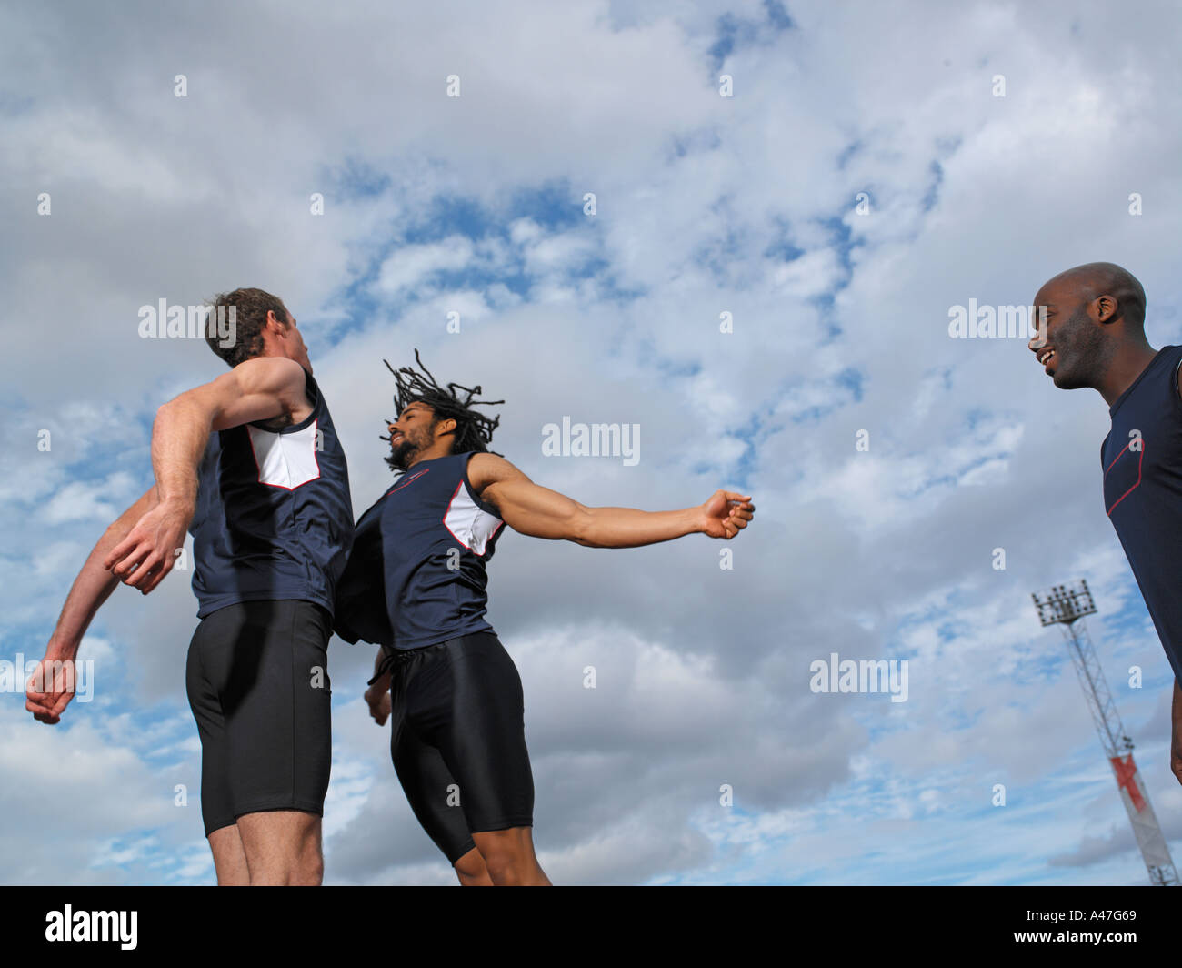 Male athletes celebrating Stock Photo - Alamy