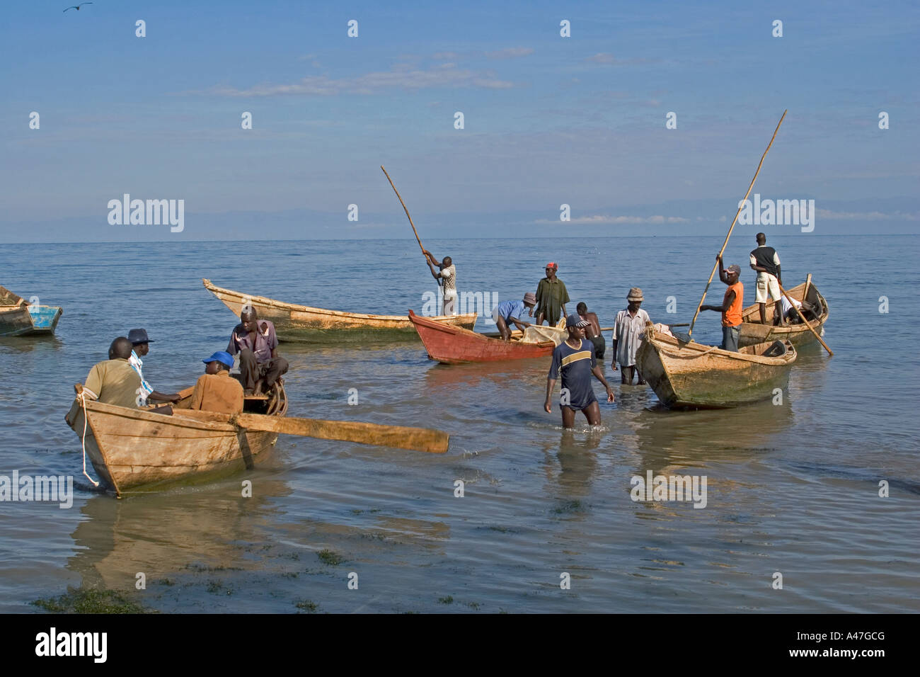 Fishermen bringing in catch on shore of Lake Albert, Northern Uganda ...