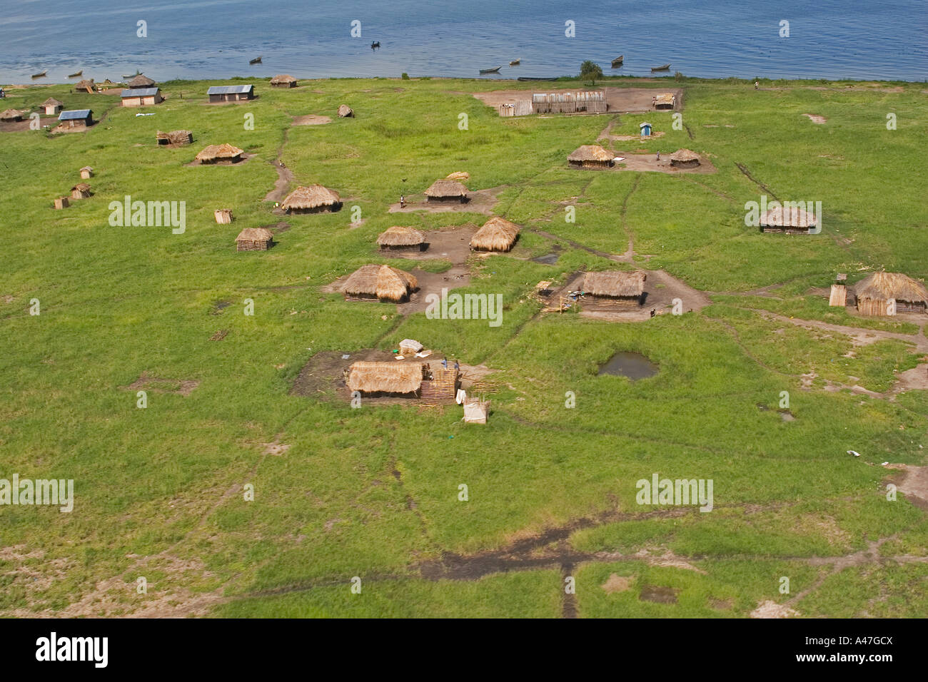 Aerial view of remote fishing village and farms on shores of Lake ...