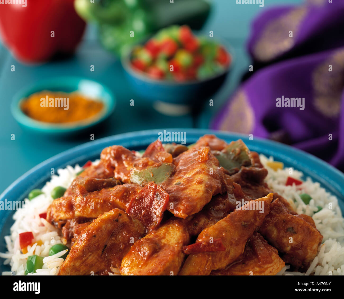 A colourful setting of Indian chicken curry and rice editorial food ...