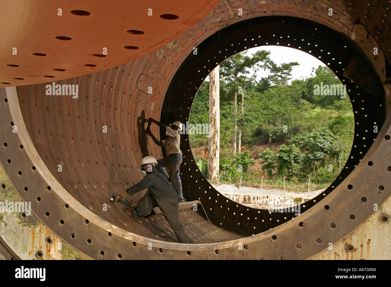 Refurbishment of ball mill interior during construction of gold mine ...