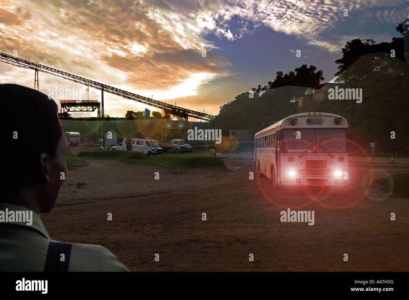 Early morning shift change. Bus with miners arriving for work at Gold ...
