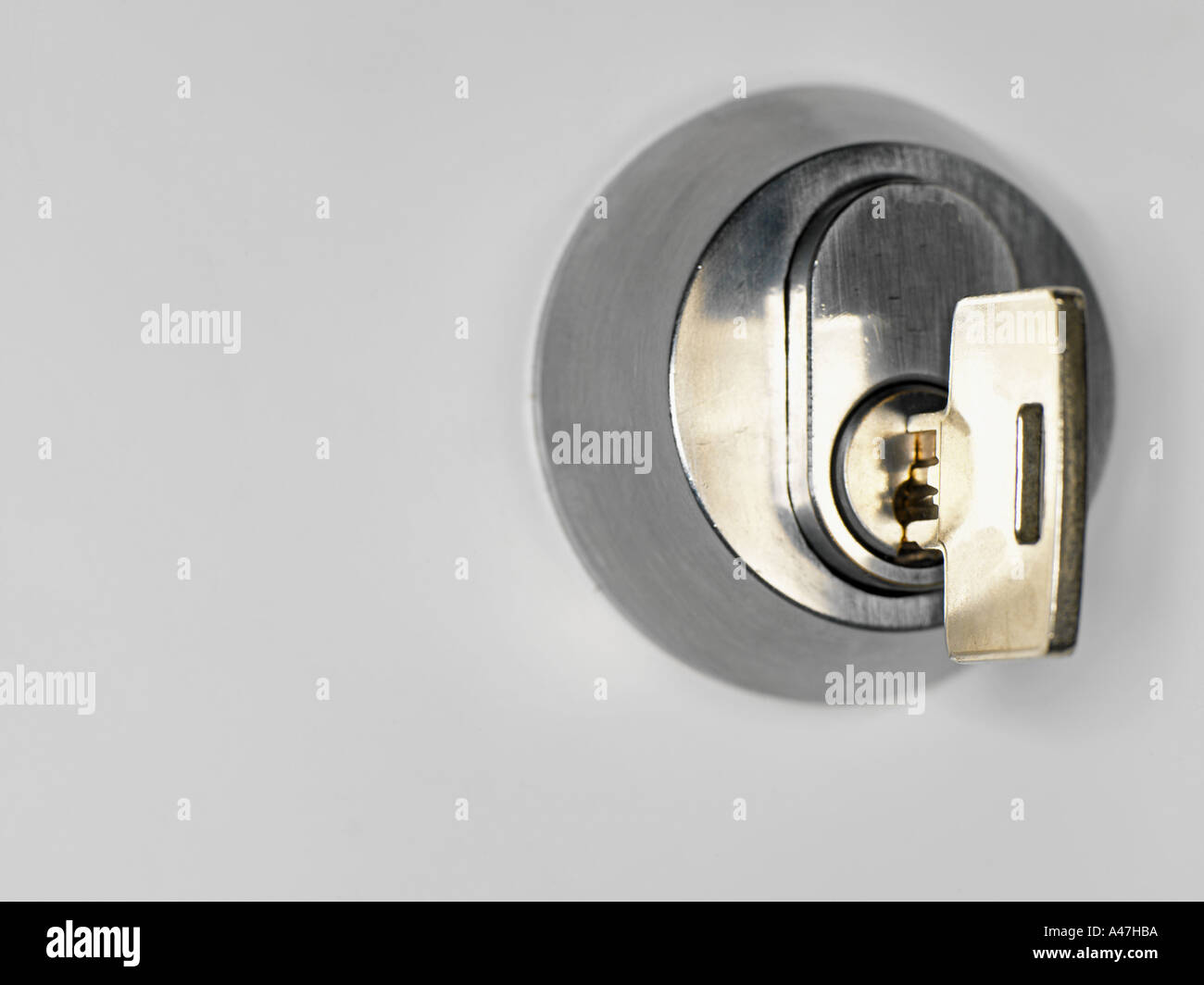 Key in door lock Stock Photo - Alamy