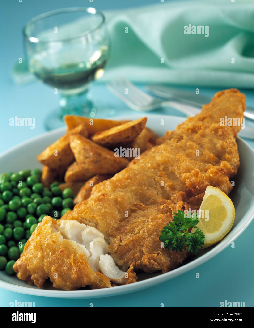 Individual portion deep fried breaded fish chips peas hi-res stock ...