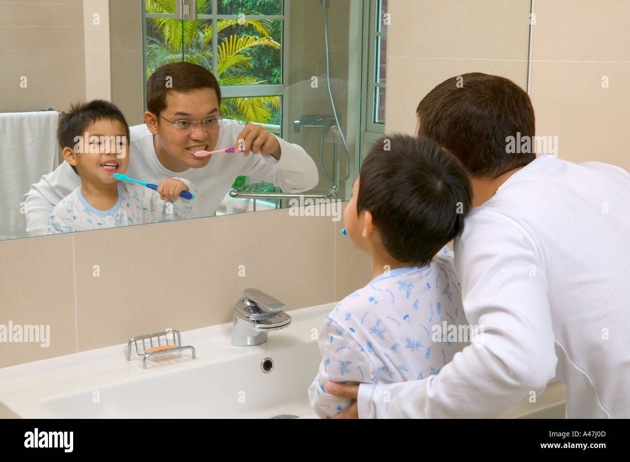 Father and son brushing teeth Stock Photo - Alamy