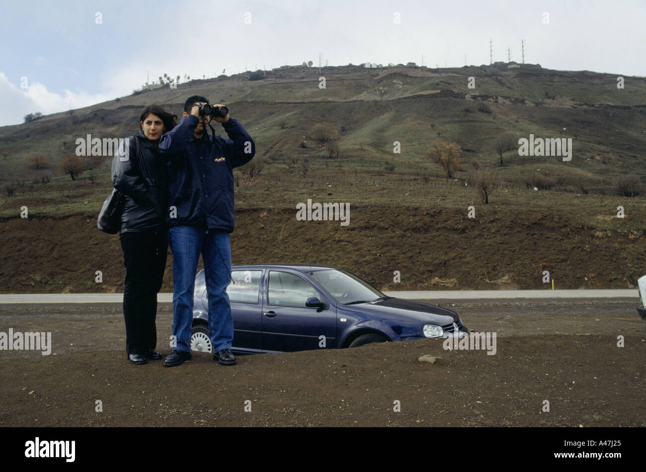 golan heights tourists from tel aviv looking down at the syrian village ...