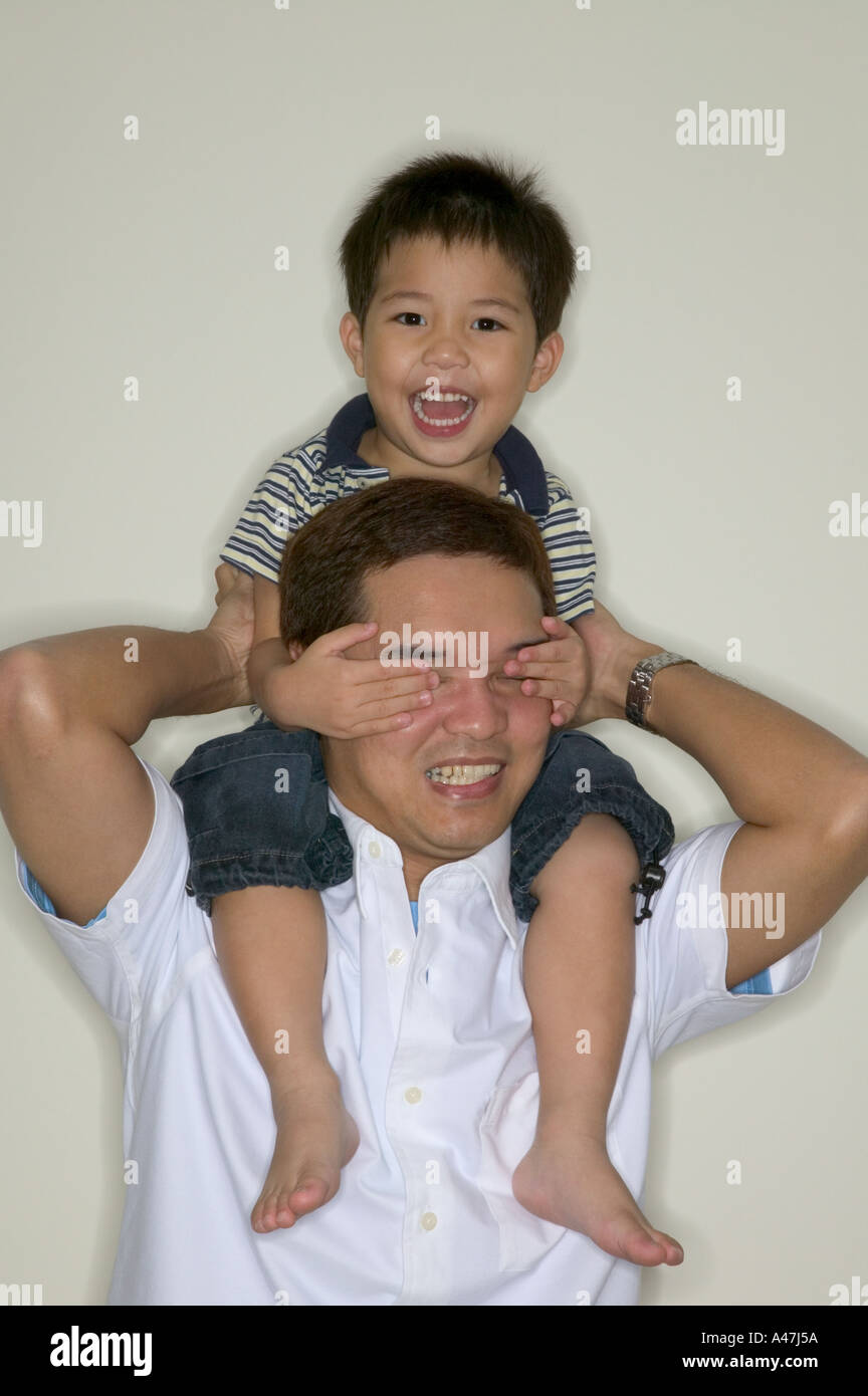 Father shoulder carrying son Stock Photo - Alamy
