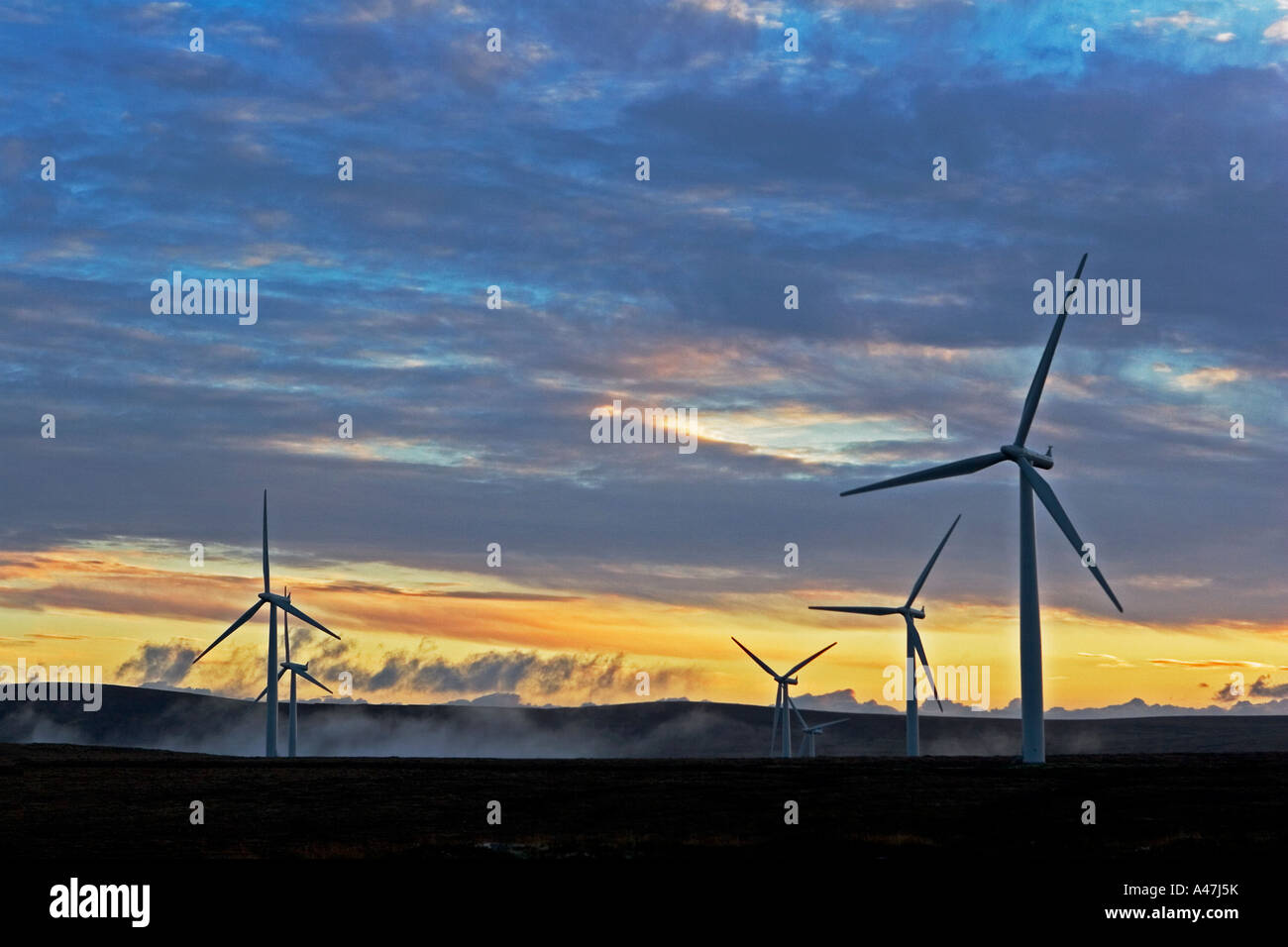 Wind power turbines at sunrise, Farr Wind Farm, Inverness, Scotland UK ...