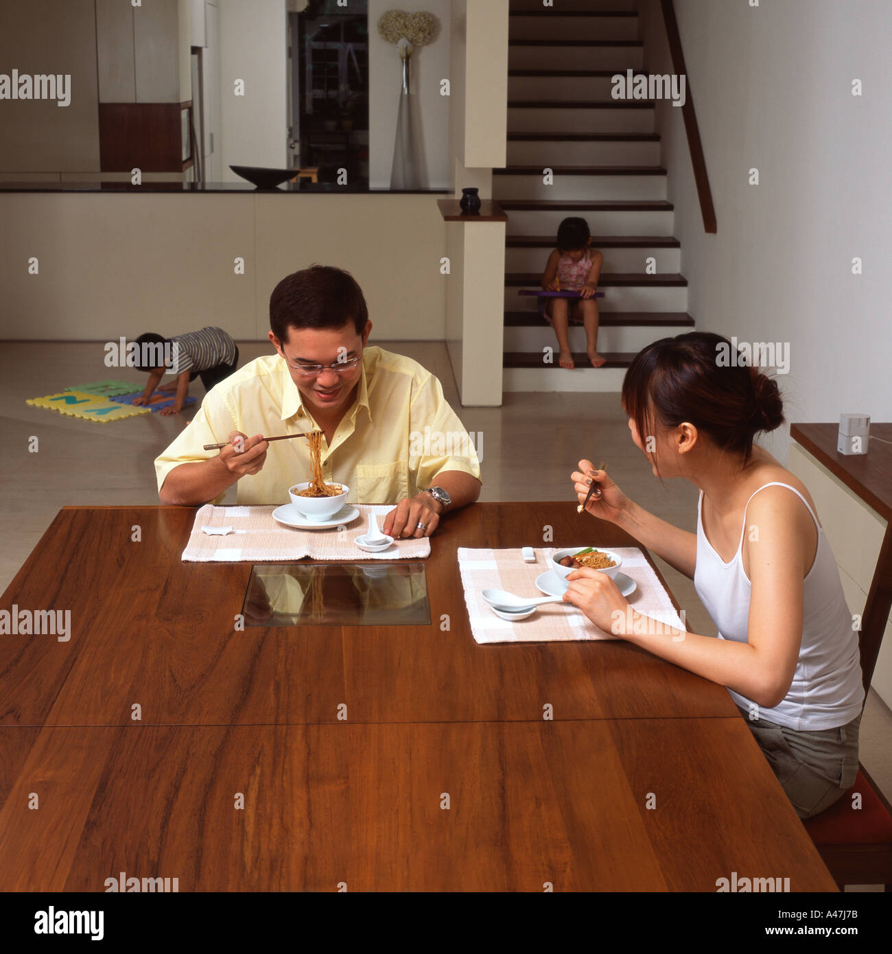 Asian Family Eating Dinner Table High Resolution Stock Photography and ...