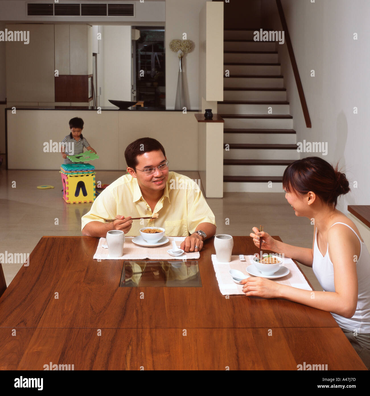 Family eating a meal Stock Photo - Alamy