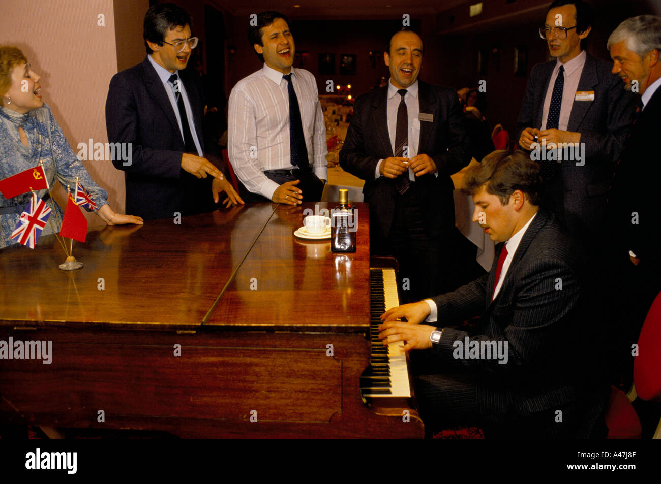 Russian Businesspeople having a sing song after dinner and drinks ...