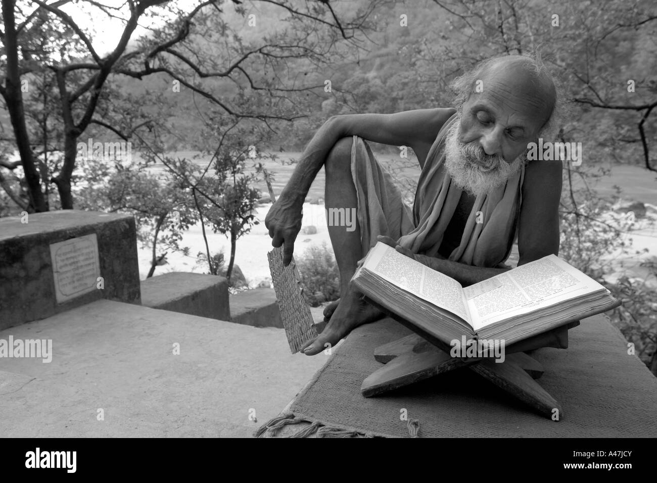 Hindu devotee reads holy hi-res stock photography and images - Alamy