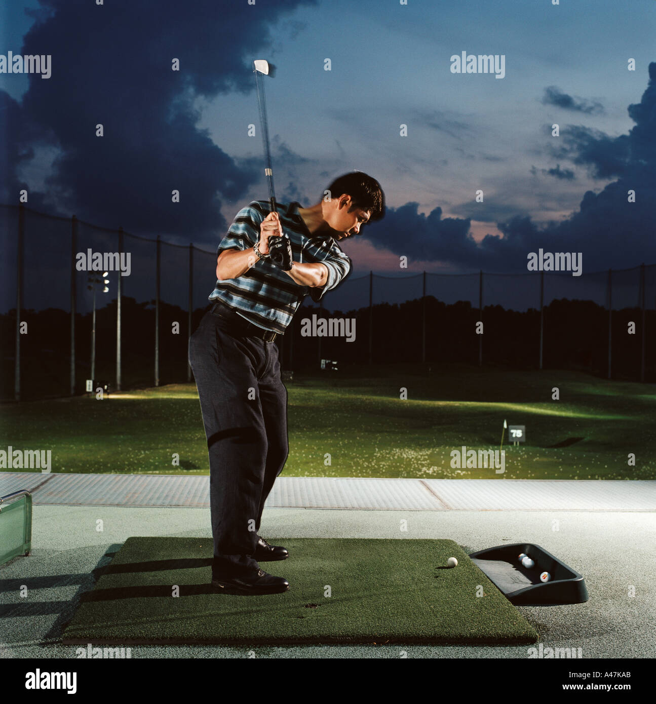 Golfer practising swing hi-res stock photography and images - Alamy
