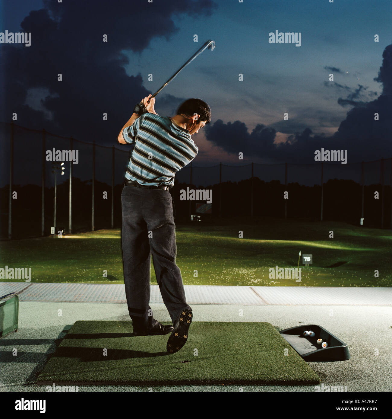 Golfer practising swing hi-res stock photography and images - Alamy