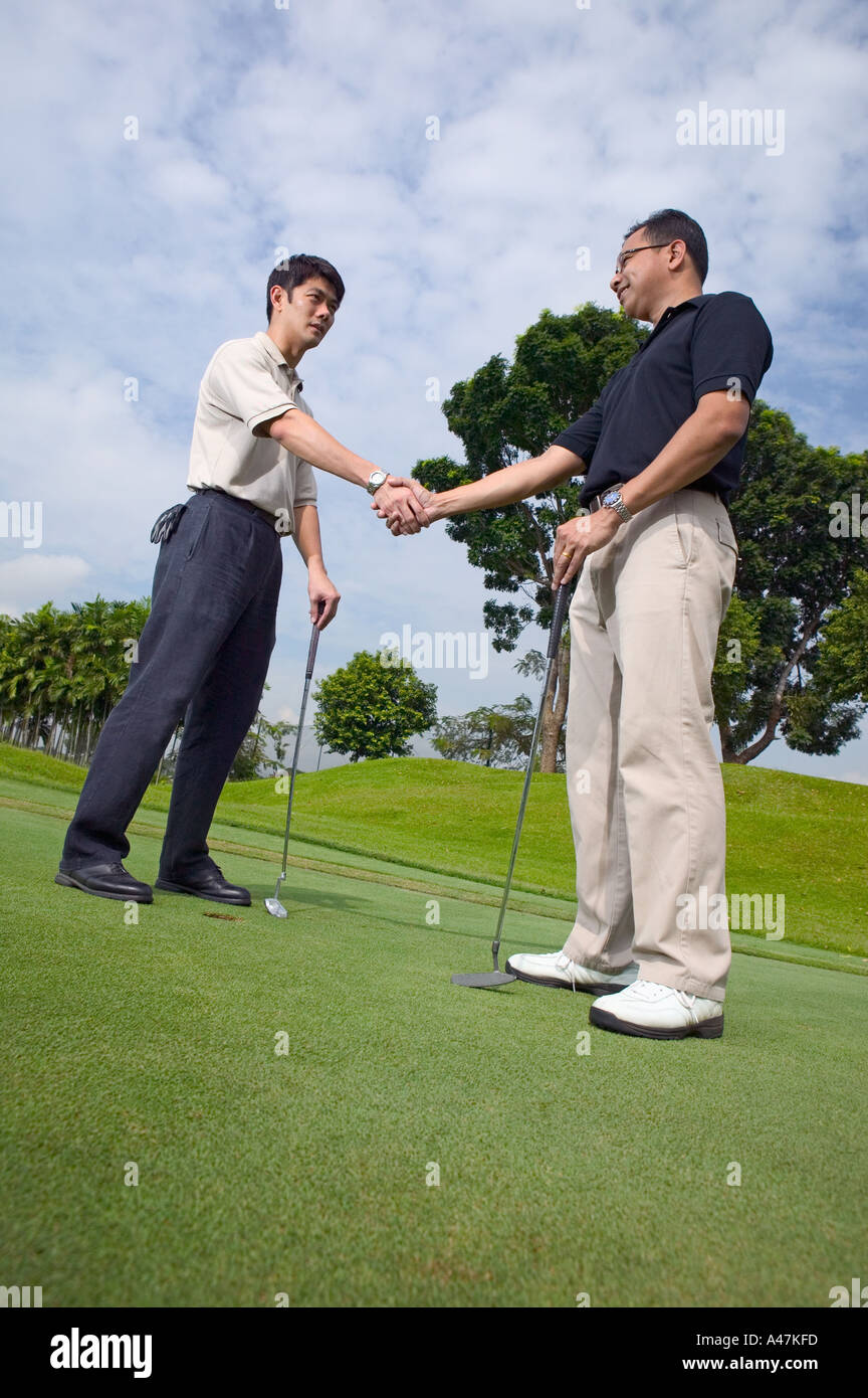 Two men playing golf hi-res stock photography and images - Alamy