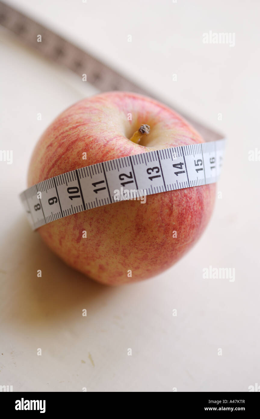 Apple and tape measure Stock Photo - Alamy