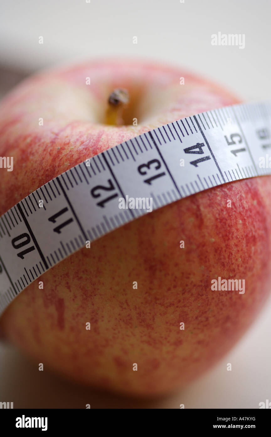 Apple and tape measure Stock Photo - Alamy