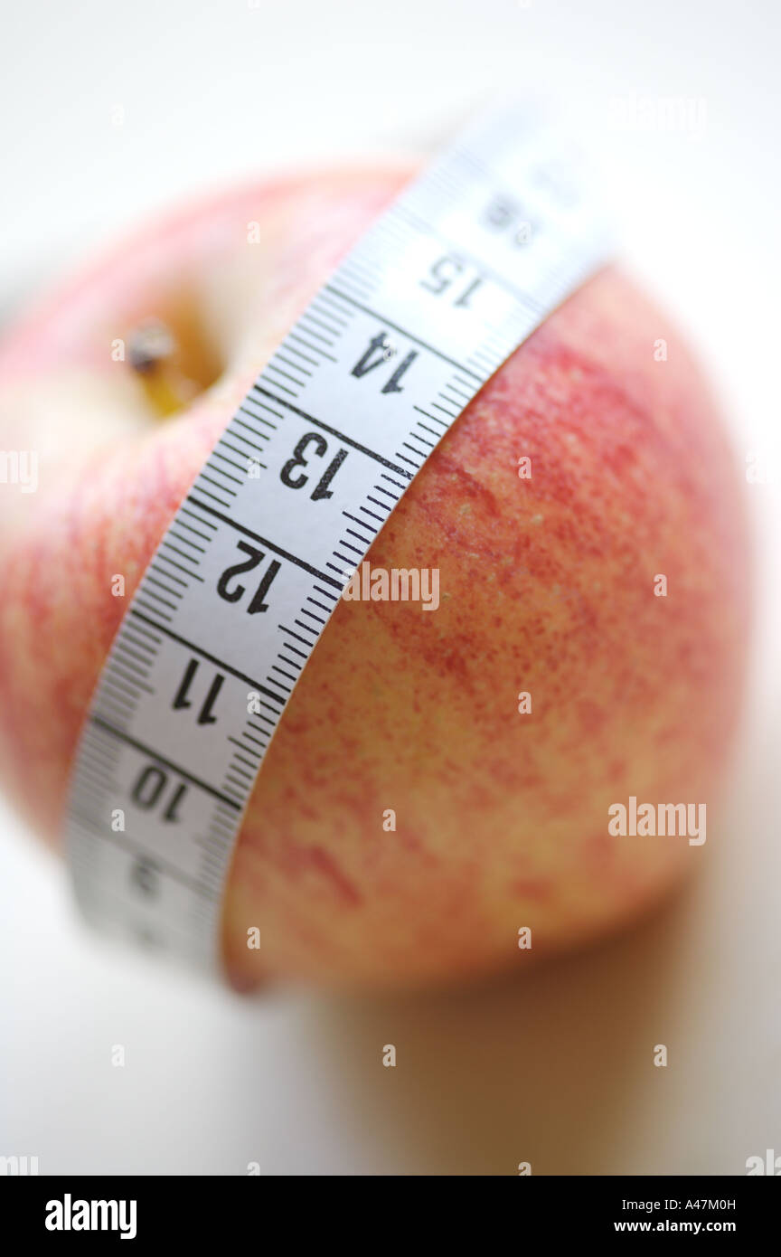 Apple and tape measure Stock Photo - Alamy