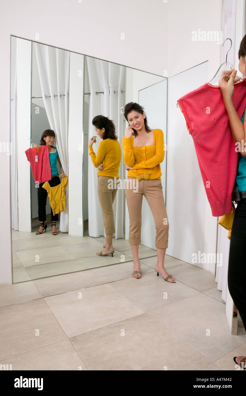 Two women in clothes store Stock Photo - Alamy