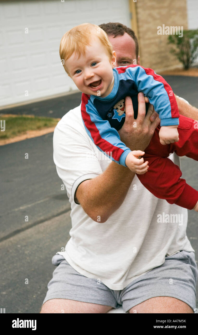 Dad and baby boy playing outside Stock Photo - Alamy