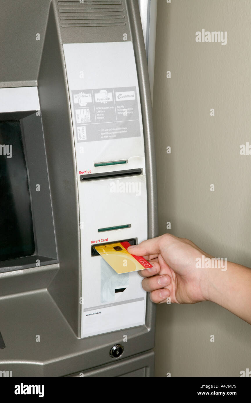 Man using a cash machine Stock Photo - Alamy