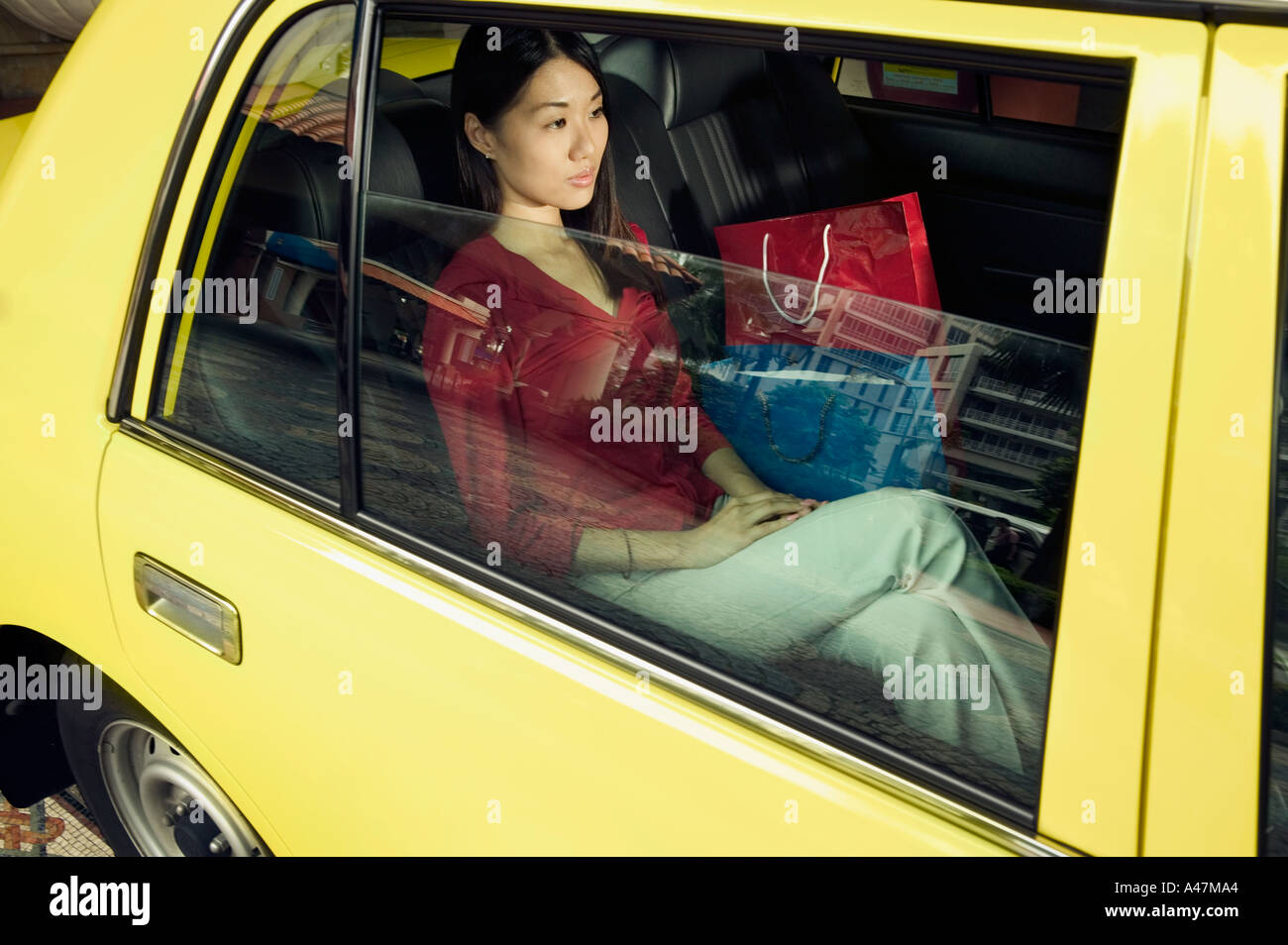 Woman in a taxicab Stock Photo - Alamy