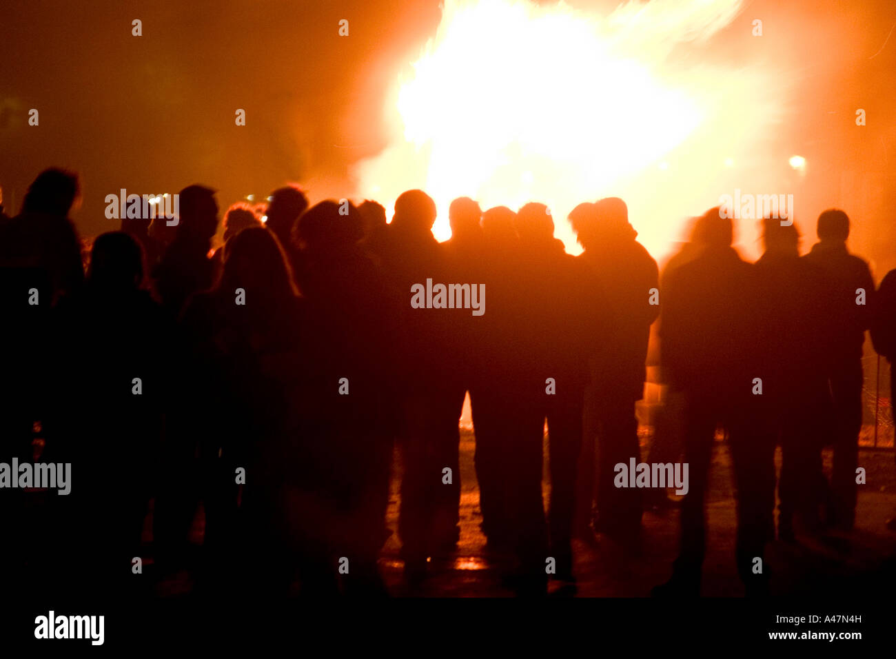 Fire flame gathering danger explosion hot people Stock Photo - Alamy
