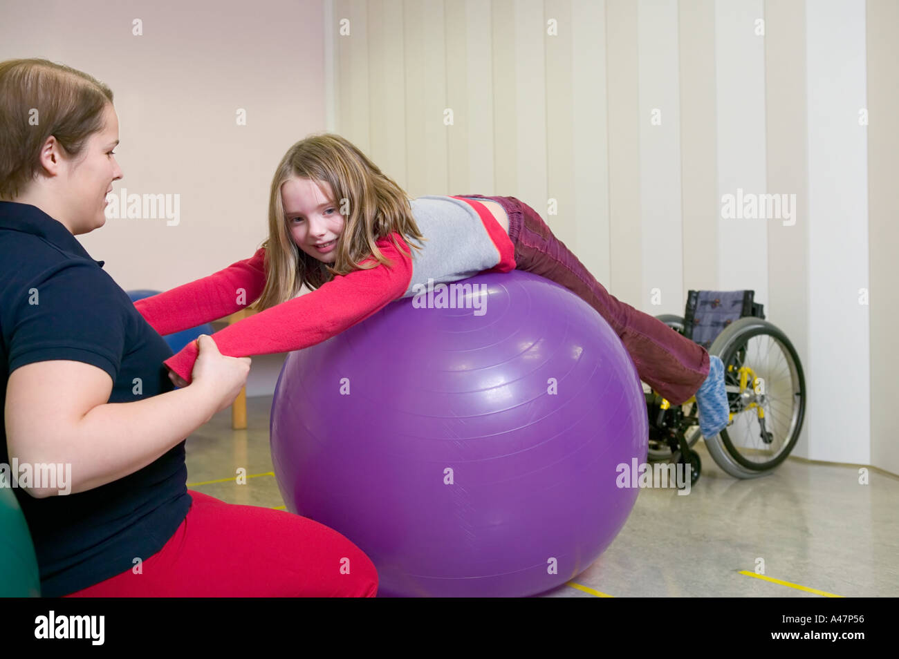 Girl exercising on fitness ball Stock Photo - Alamy