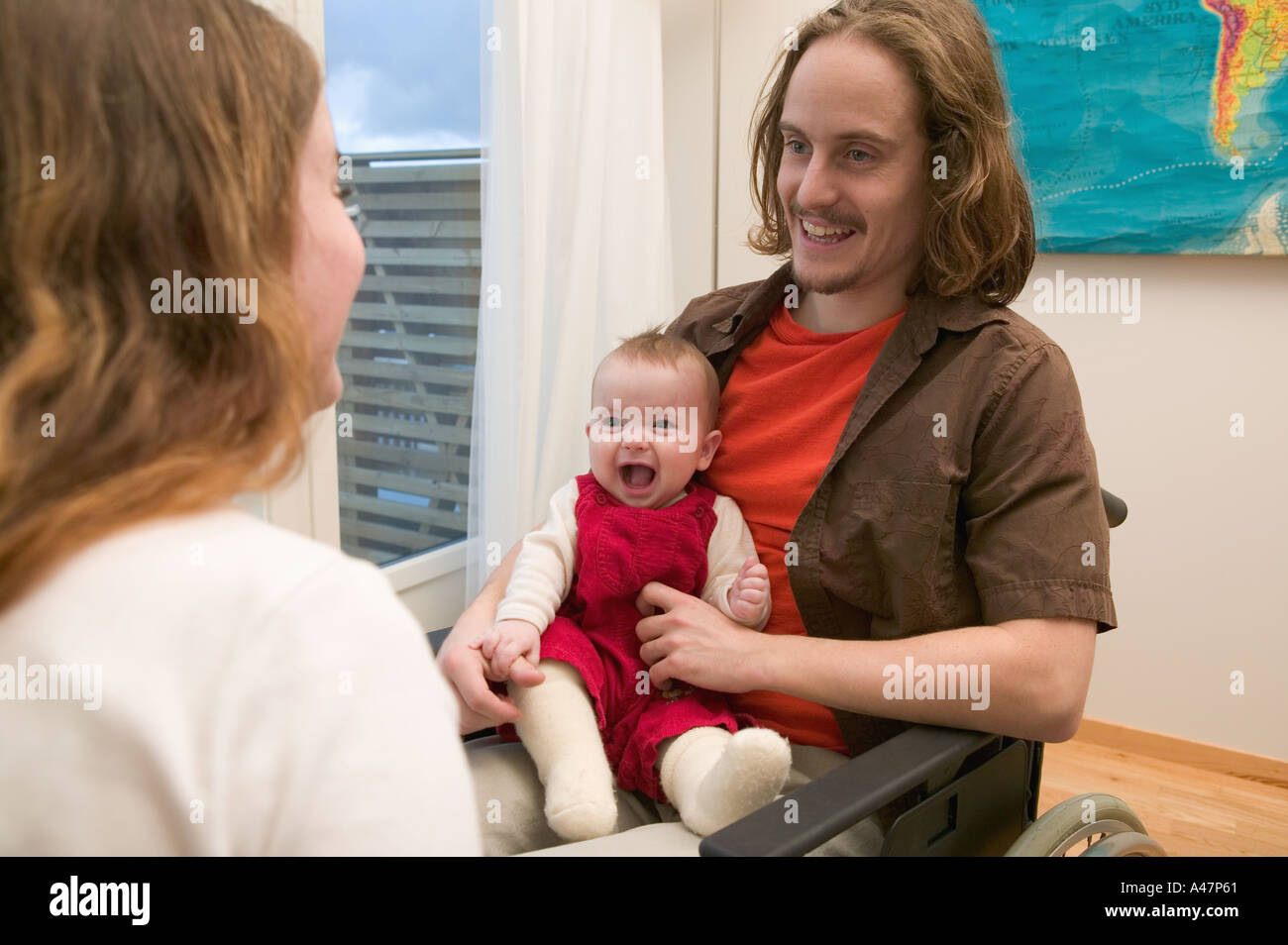 Disabled man with baby Stock Photo - Alamy