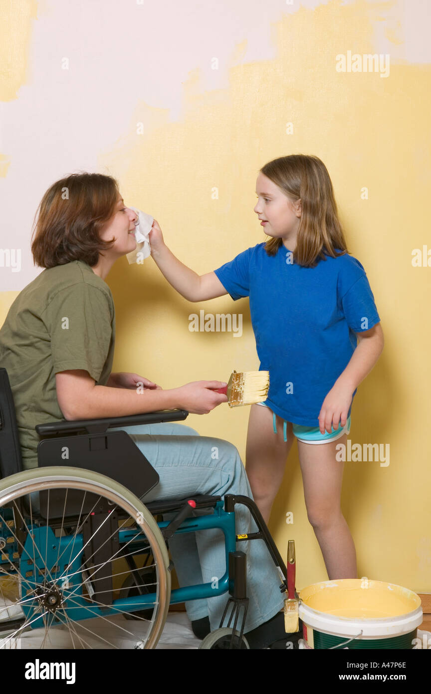 Disabled mother and daughter decorating Stock Photo - Alamy