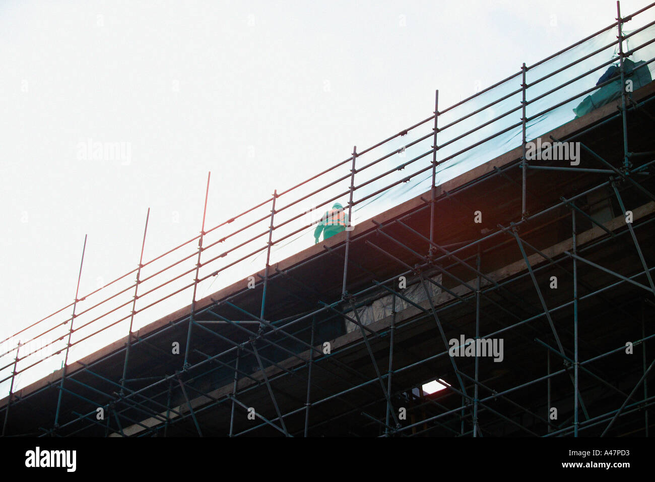 Men up on construction site Stock Photo - Alamy