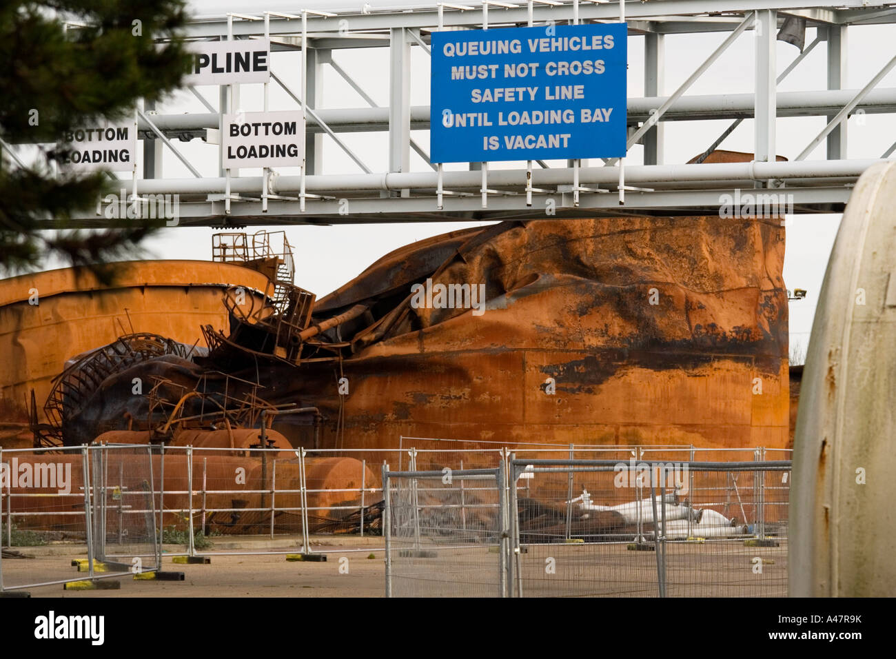 Damaged oil tanks and safety notice, Buncefield depot, Hemel Hempstead ...
