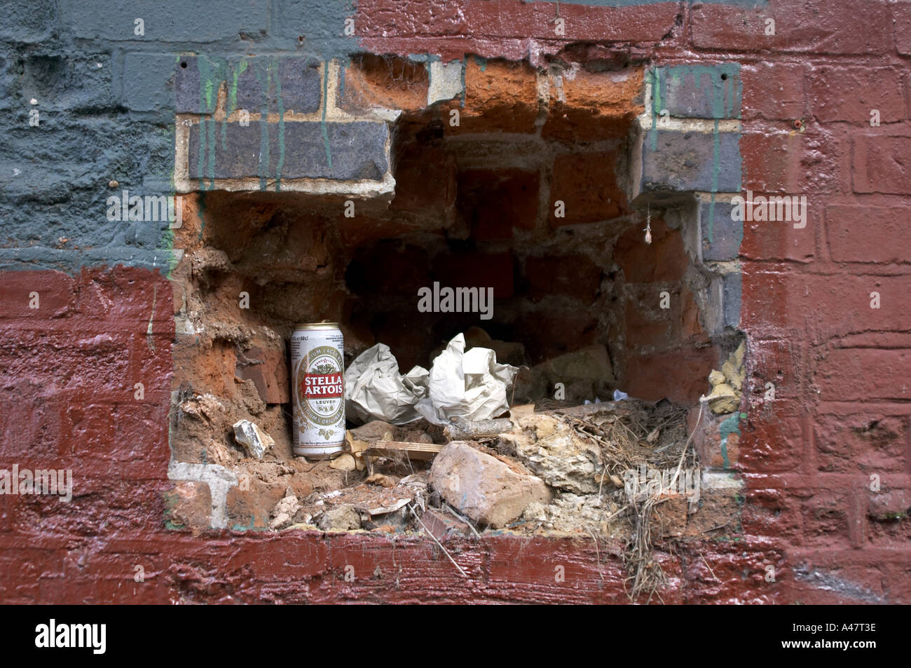Abstract image of litter rubbish or trash with beer can in hole in ...
