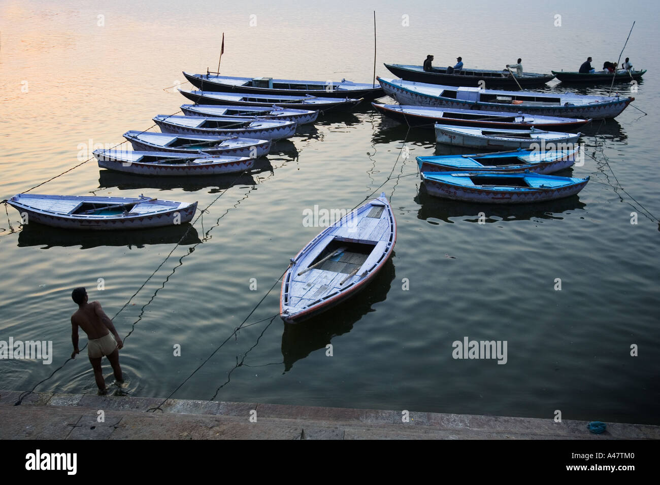 Varanasi Boats in the Ganges at Dawn Stock Photo - Alamy
